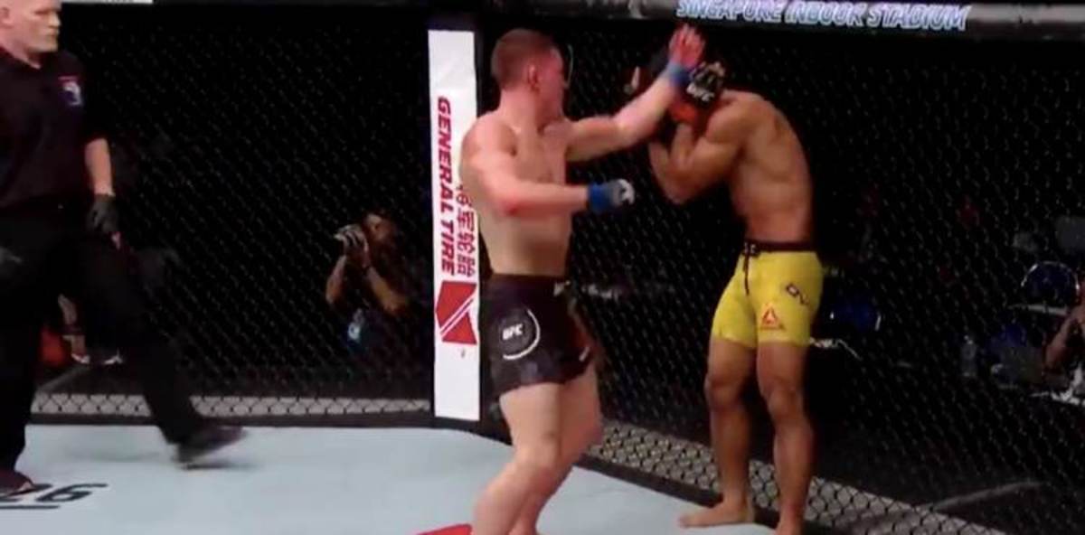 Shane Young Blasts Rolando Dy with Brutal Elbow (UFC Singapore ...