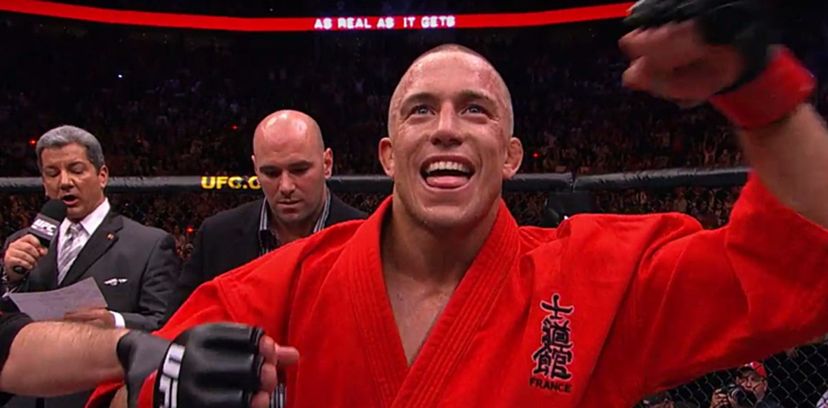 Georges St-Pierre Chokes Out Michael Bisping to Become UFC Middleweight ...
